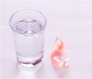 What can I soak my dentures in overnight? - The Denture & Implant Clinic